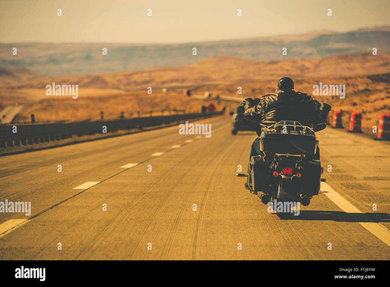 Biker Riding Motorcycle on the Nevada HIghway, USA. Motorbiking Theme ...