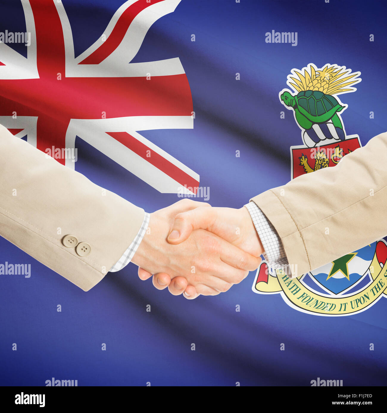 Businessmen shaking hands with flag on background - Cayman Islands ...