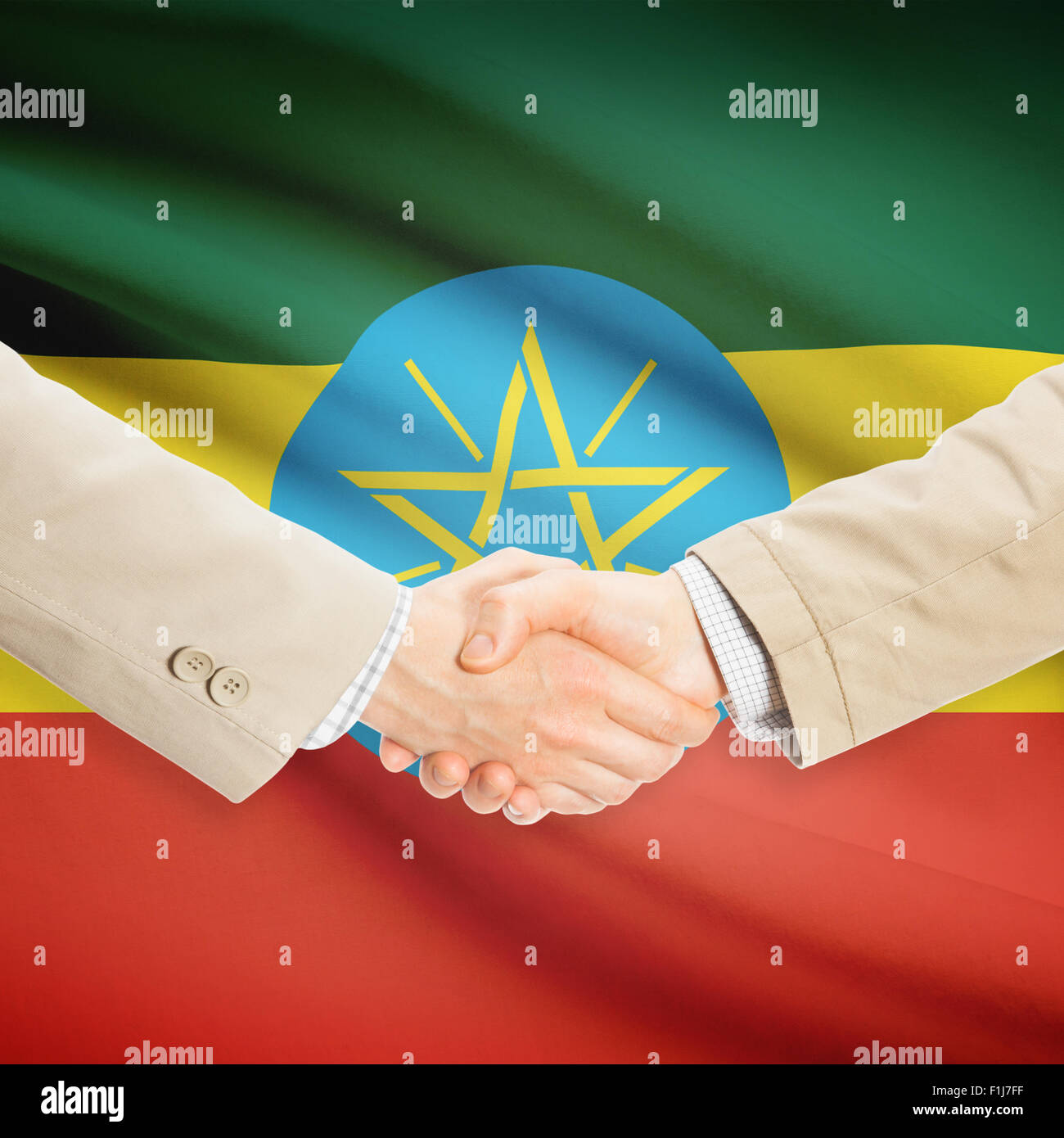 Businessmen shaking hands with flag on background - Ethiopia Stock ...