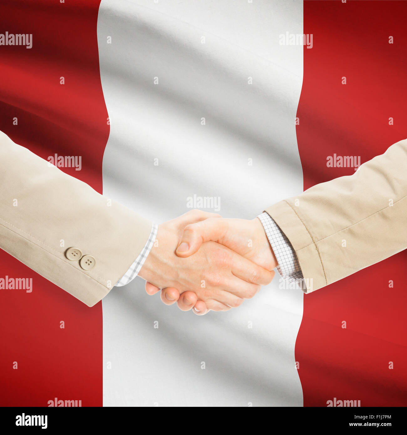 Businessmen shaking hands with flag on background - Peru Stock Photo ...