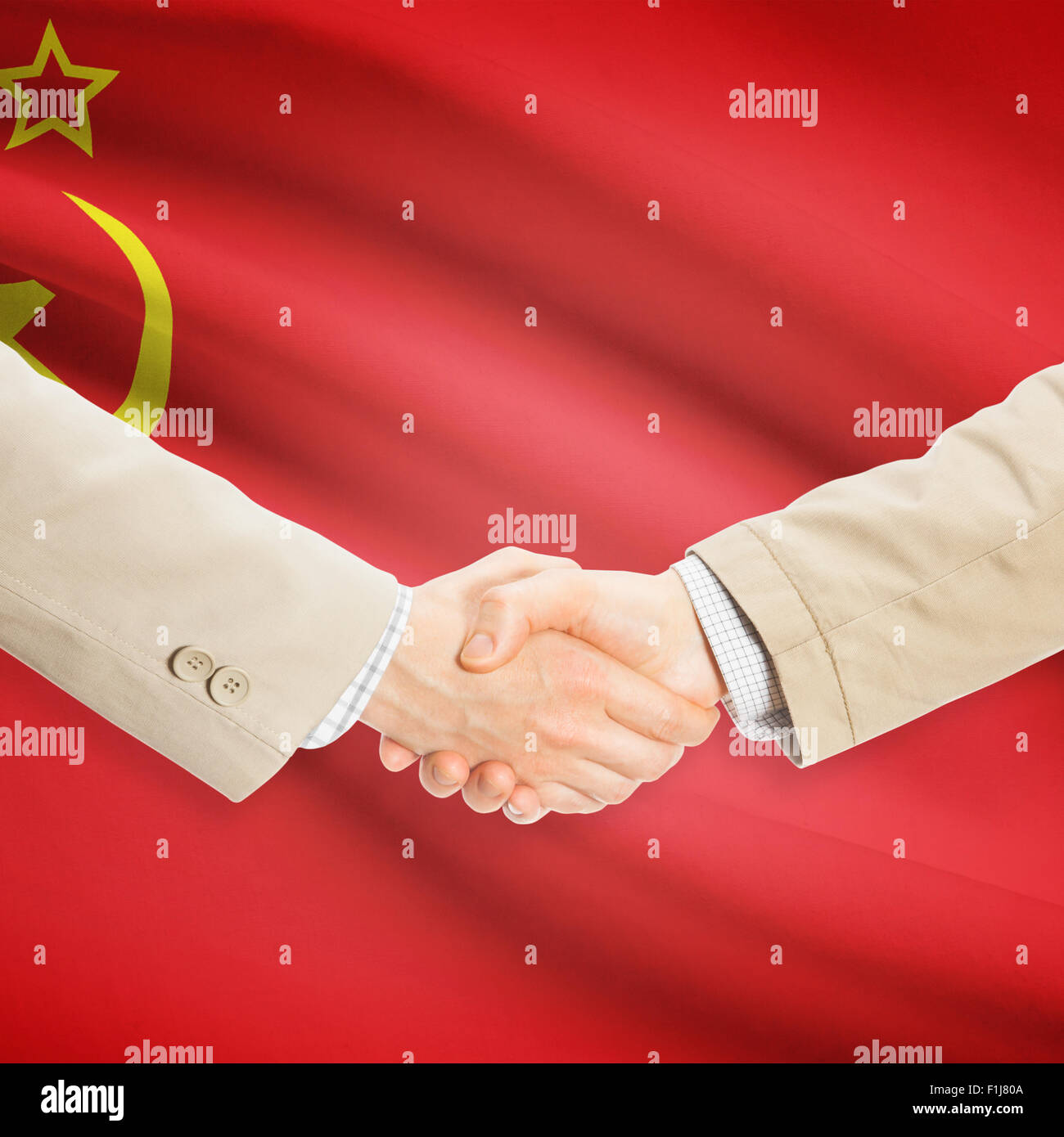 Businessmen shaking hands with flag on background - USSR - Soviet Union ...