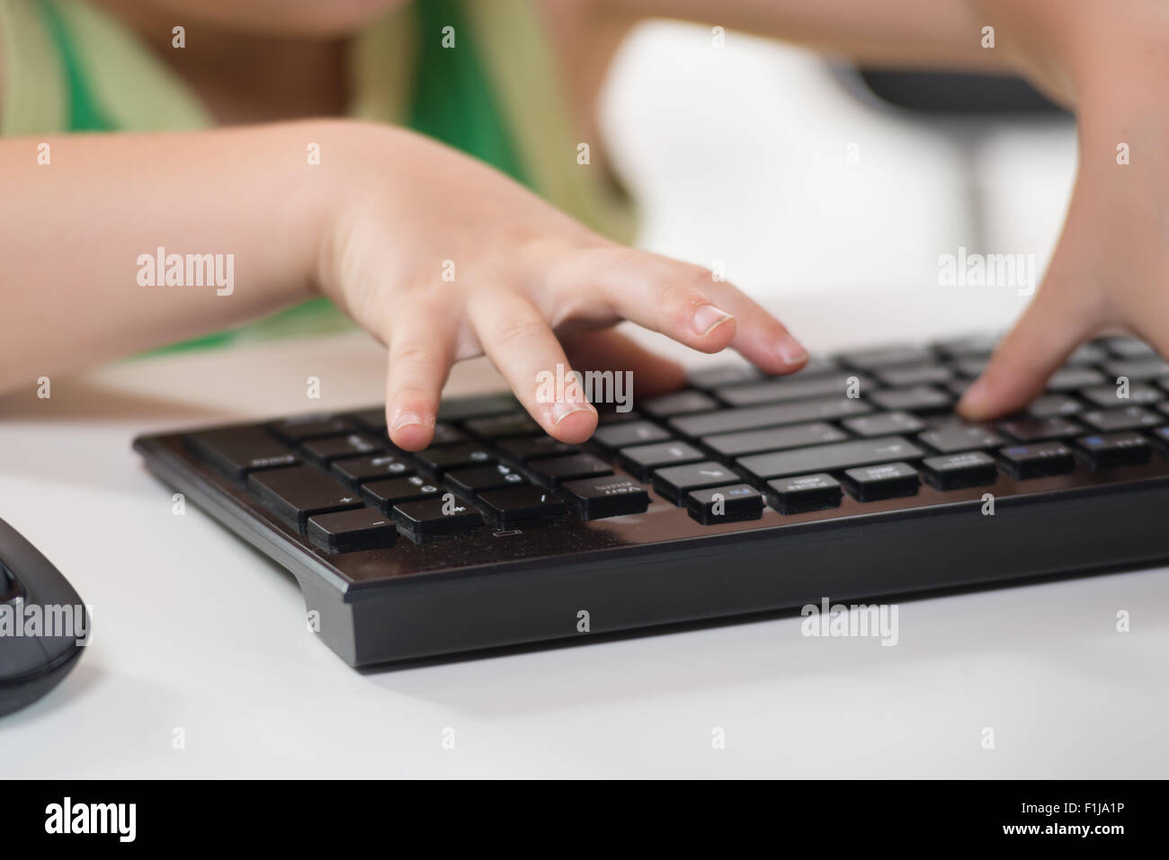 close-up on a child's hands on the keyboard Stock Photo - Alamy