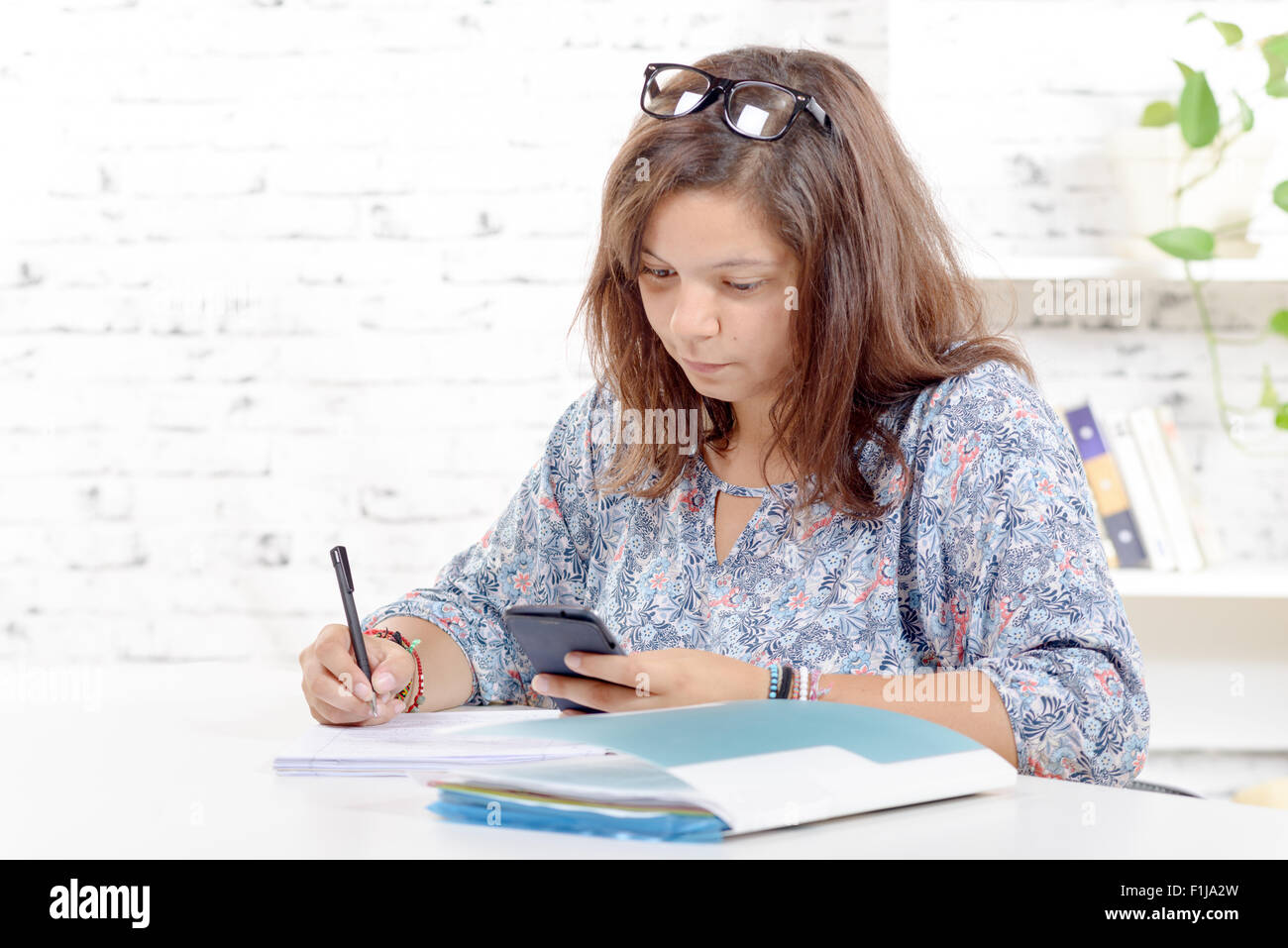 a teenage girl doing her homework Stock Photo - Alamy