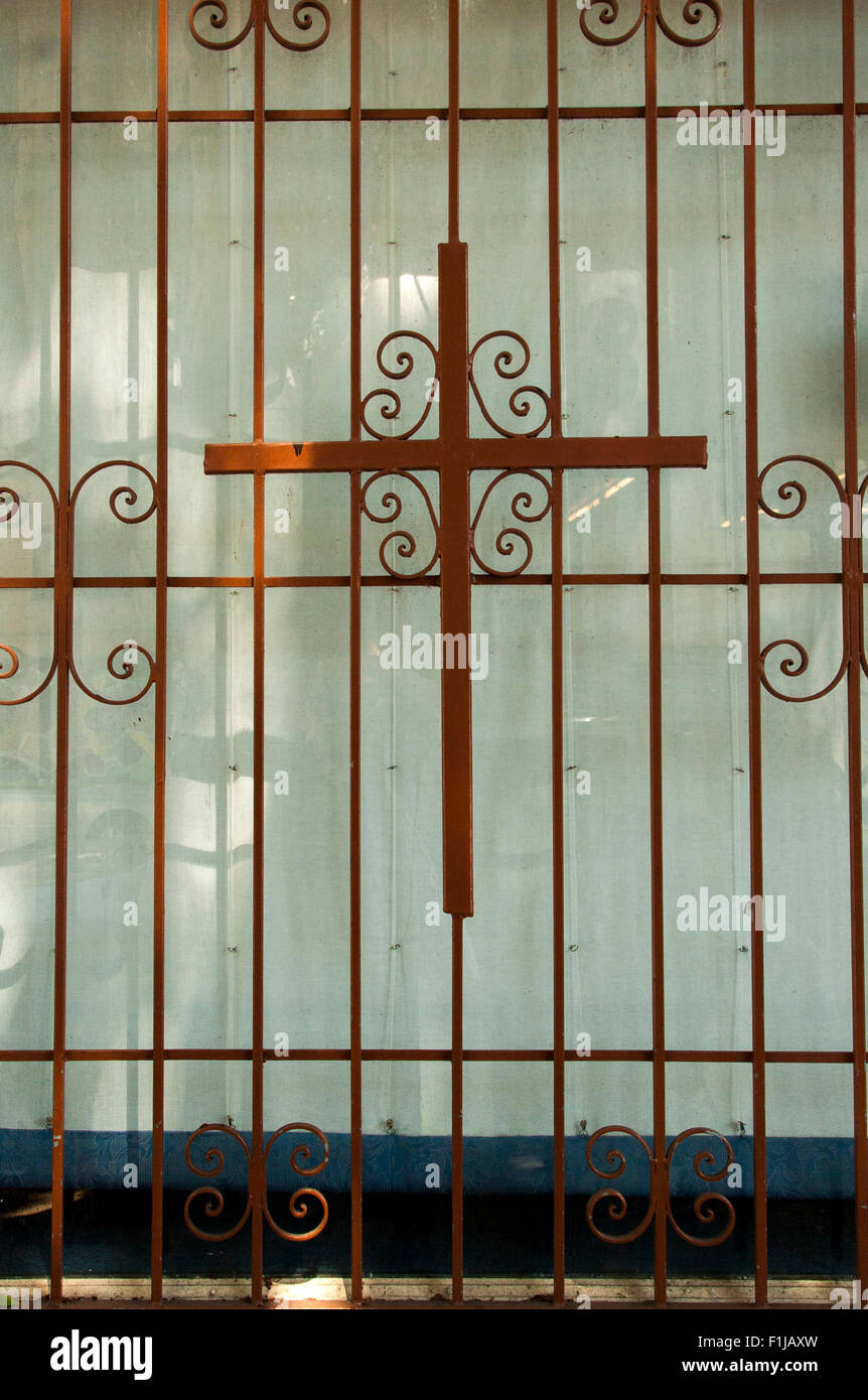 Cross added onto a window screen on 24th Street in The Mission in San ...