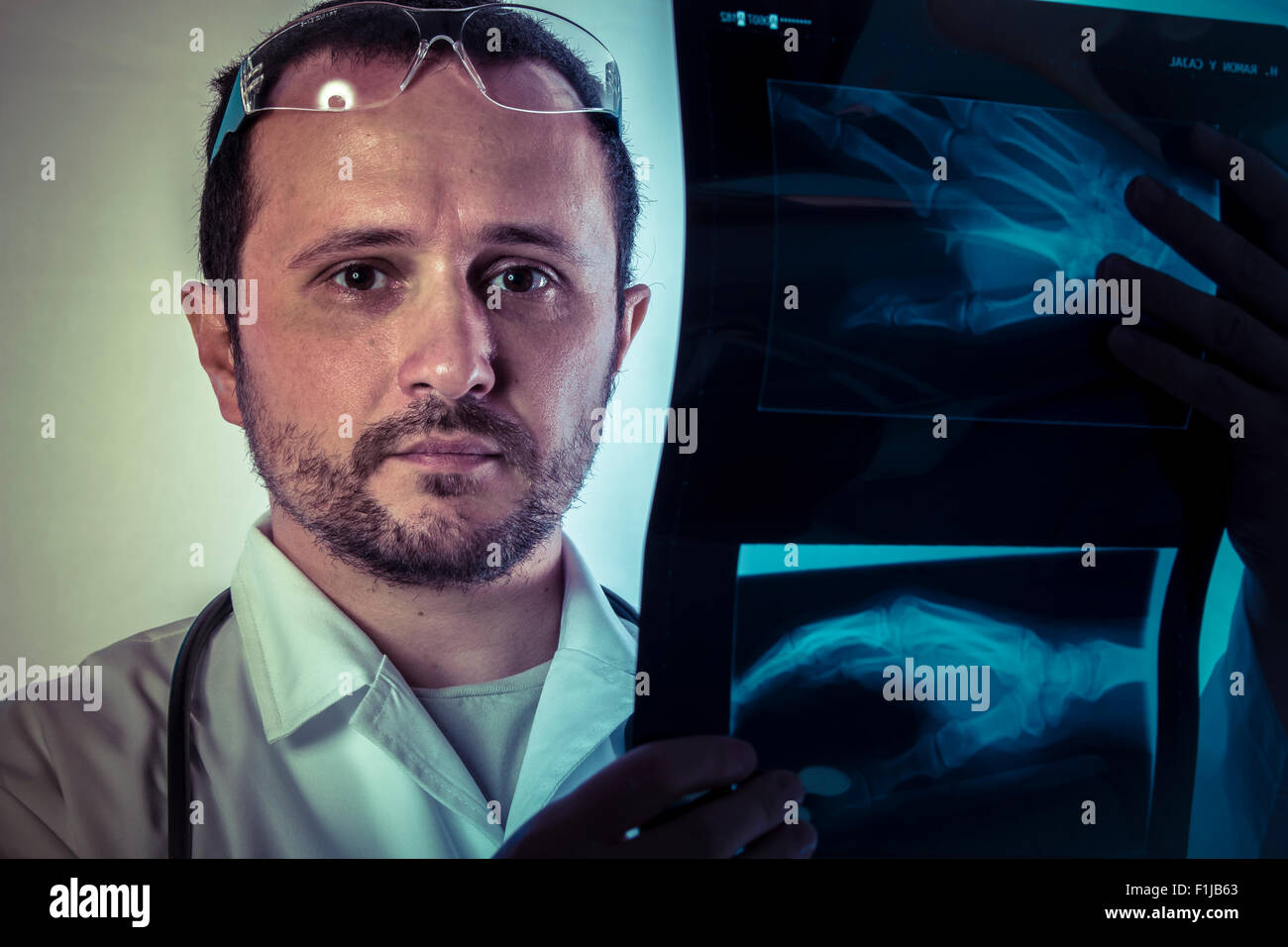 Radiographer, Radiologist looking at an x-ray in hospital Stock Photo ...