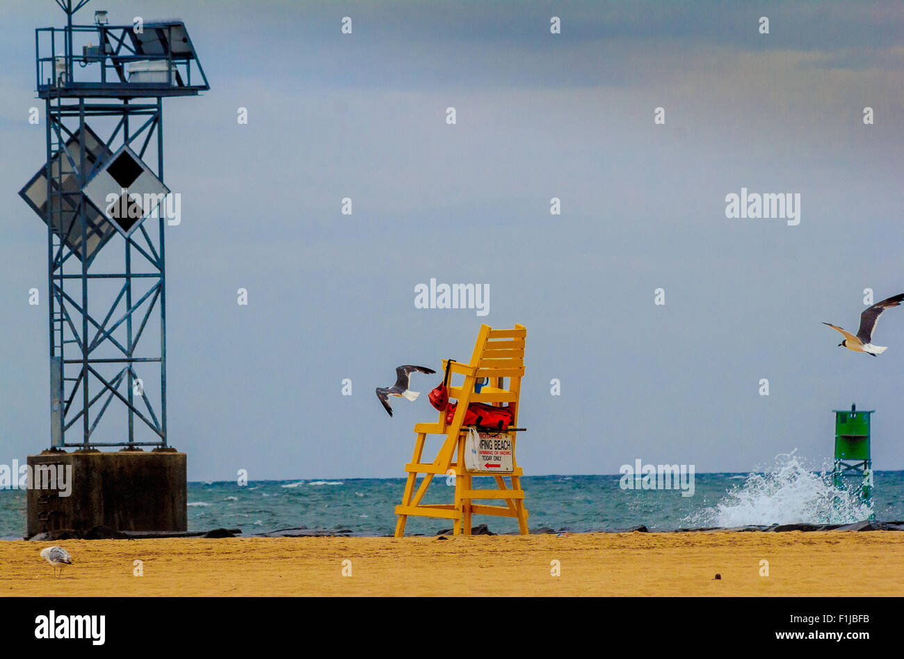 Chilly Day at the Ocean City Inlet beach Stock Photo - Alamy
