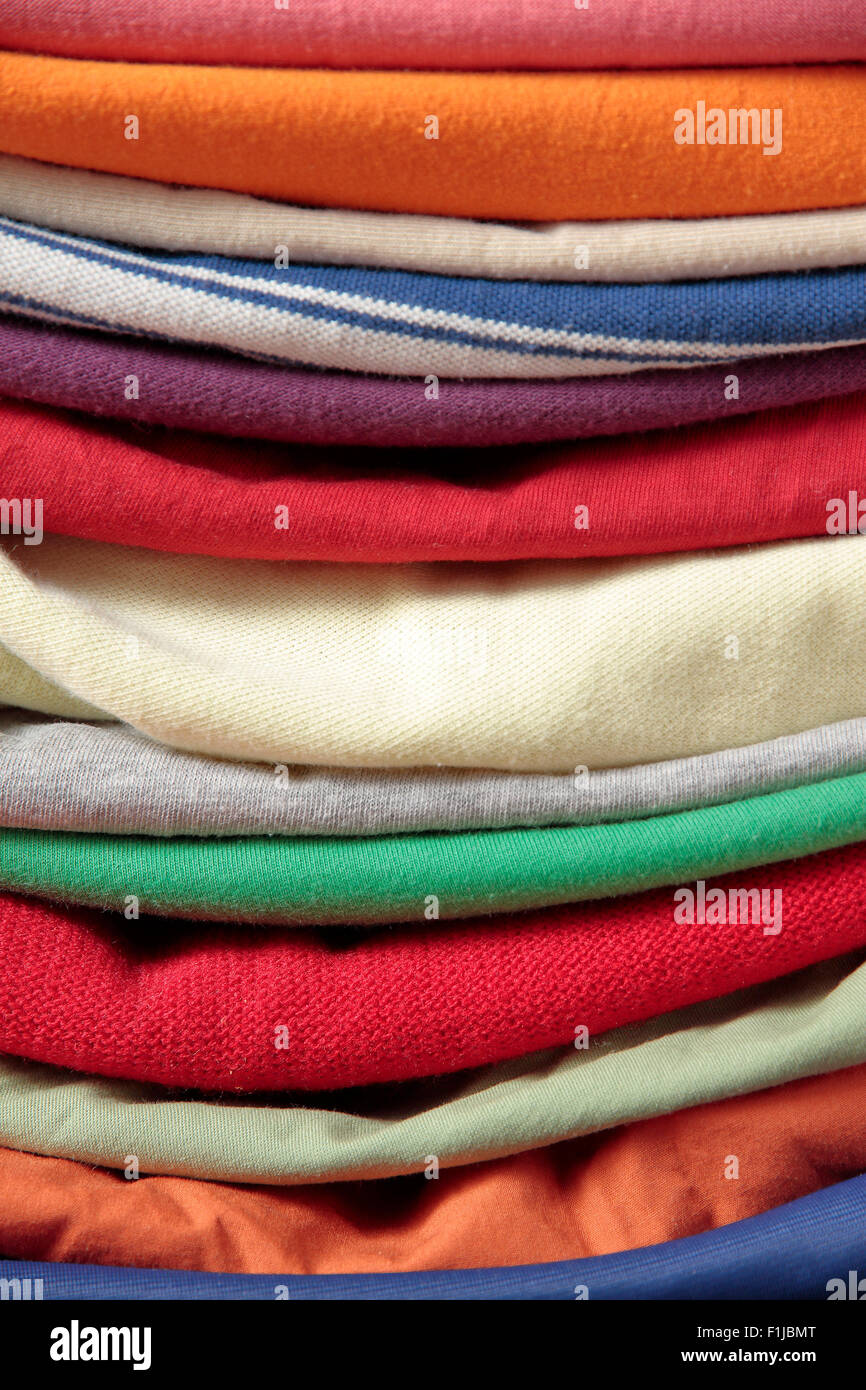 background of used clothes of differents colors Stock Photo - Alamy