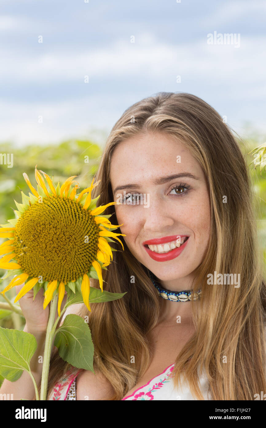 Girl with sunflower Stock Photo - Alamy