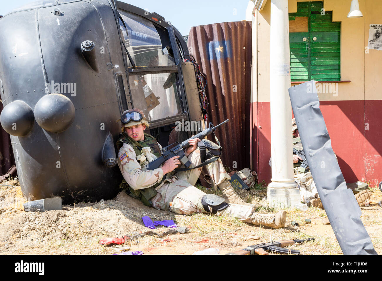 American army, black Hawk re-enactment. Weary looking soldier taking ...