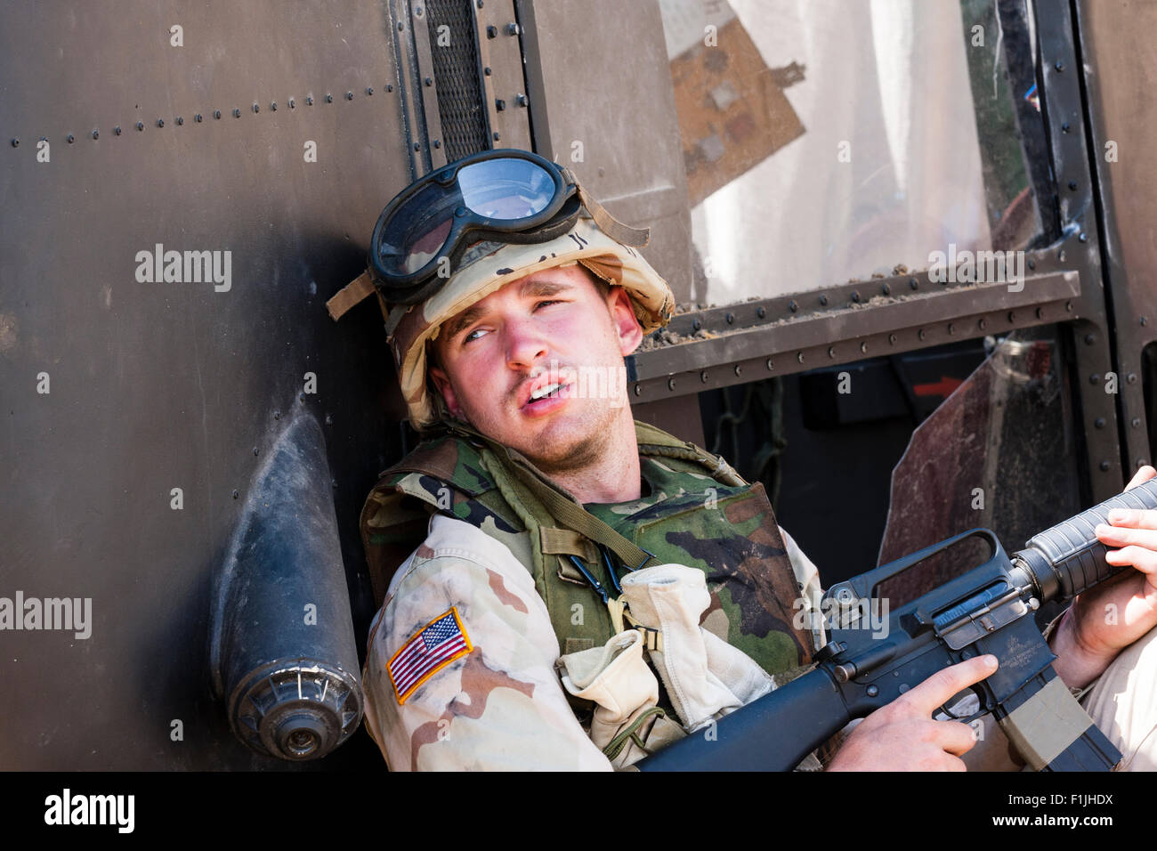American army, black Hawk re-enactment. Weary looking soldier taking ...