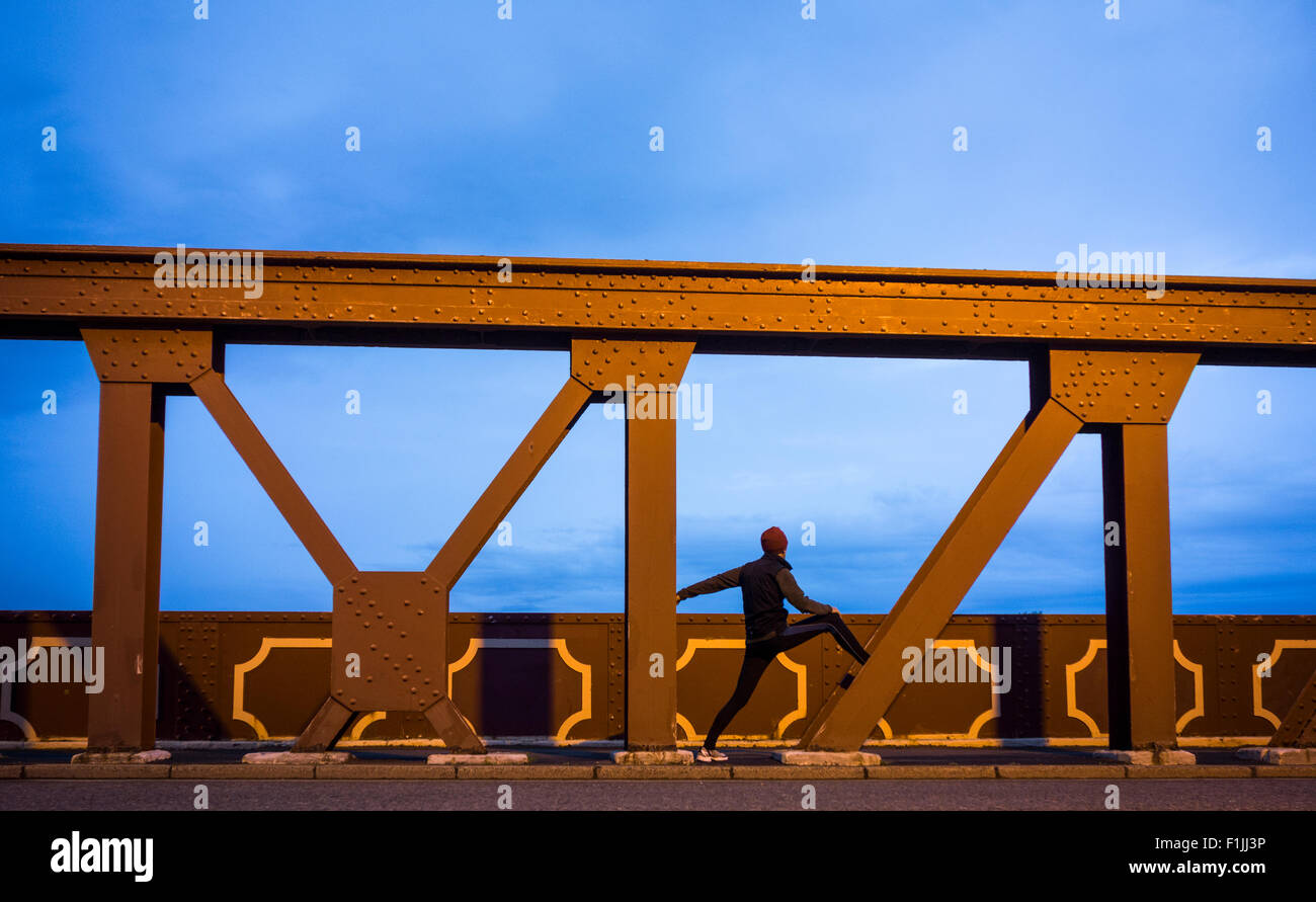 Rear view of man running over bridge hi-res stock photography and ...