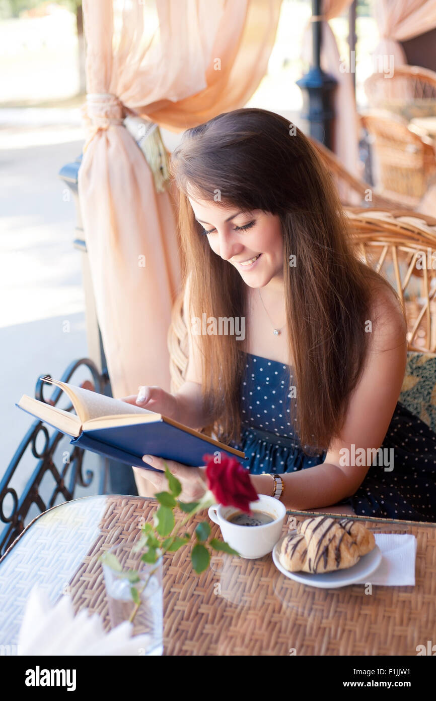 Reading a book, cafe hi-res stock photography and images - Alamy