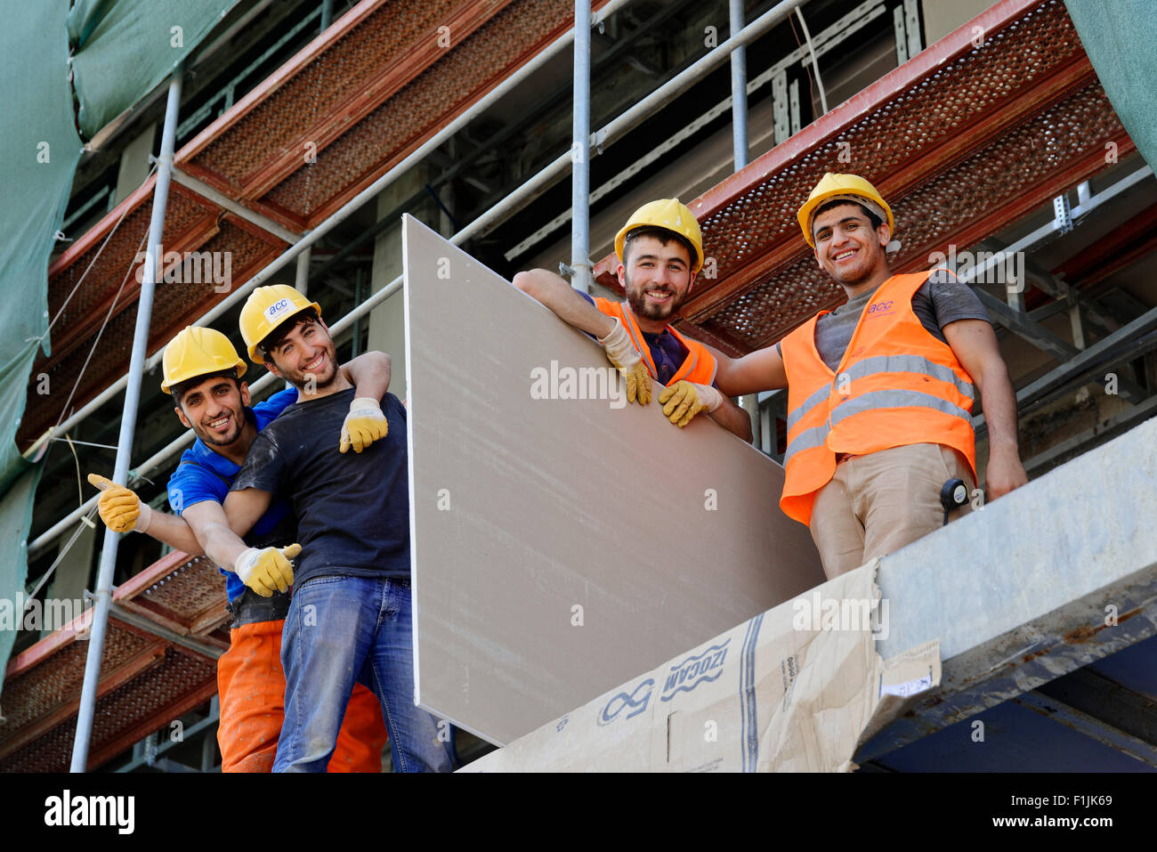 Construction workers on scaffolding, construction site, the European ...