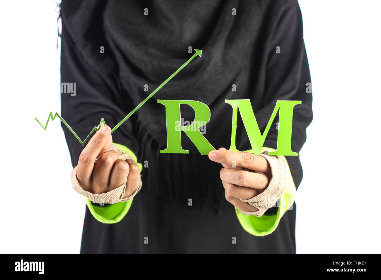 female hand holds green malaysia ringgit sign with green arrow Stock ...