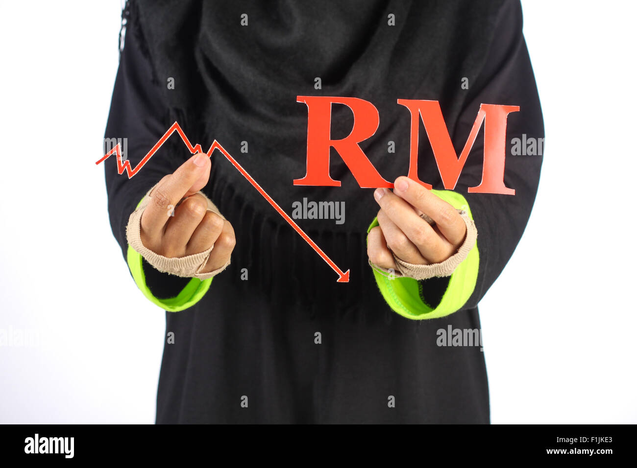 female hand holds red malaysia ringgit sign with red arrow Stock Photo ...