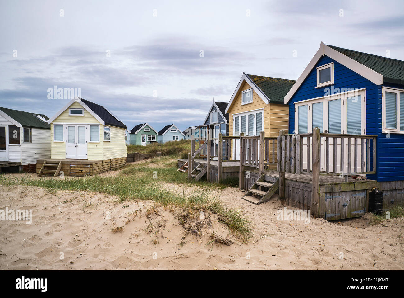 Beach huts on sand dunes and beach landscape Stock Photo - Alamy