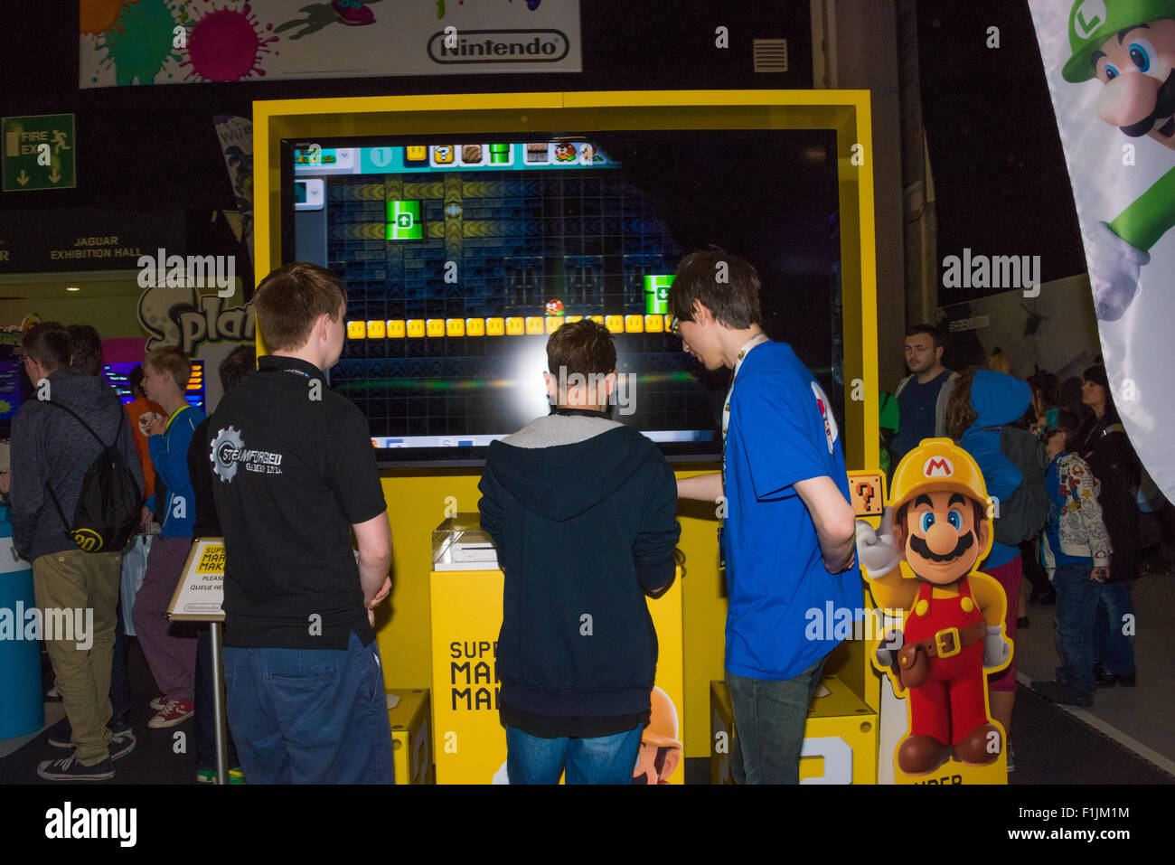 Teenage lads playing on giant screen Super Mario at Insomnia55 the ...