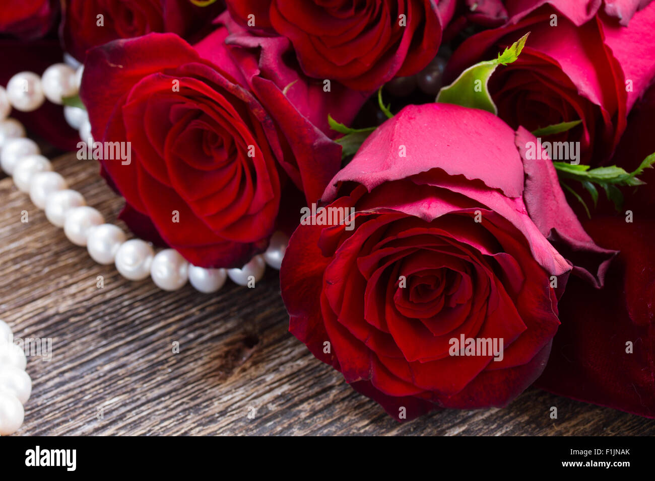 red roses on velvet Stock Photo - Alamy