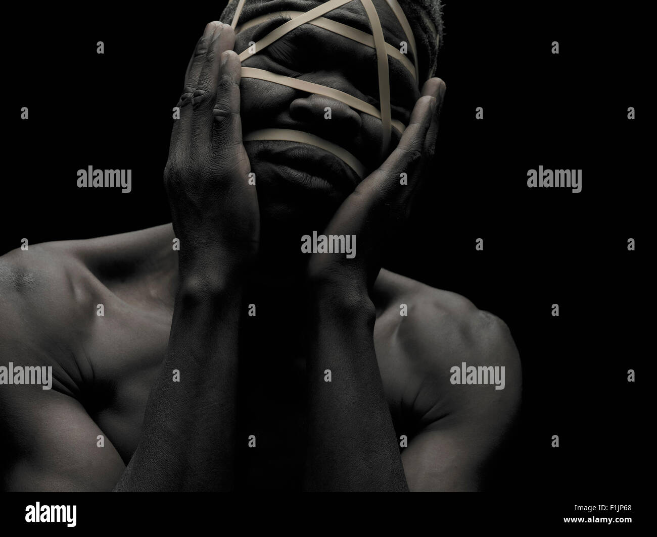 Man with Face Wrapped in Elastics Stock Photo - Alamy