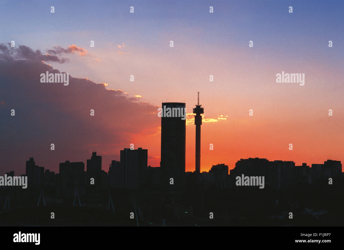 Johannesburg skyline with silhouette of Ponte Tower and Hillbrow Tower ...