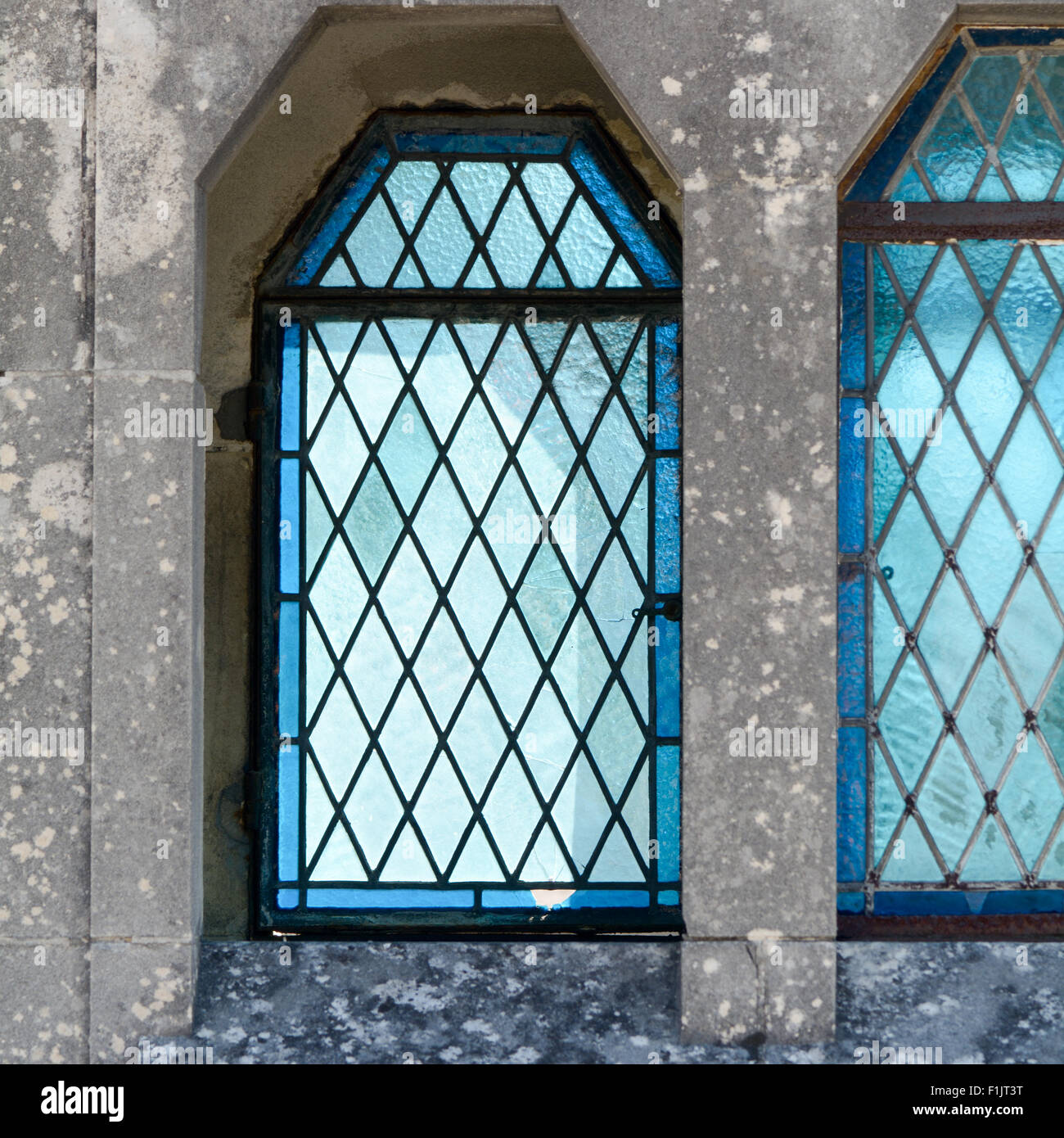 Blue stained glass windows in tomb in cemetery in Bordeaux, France ...