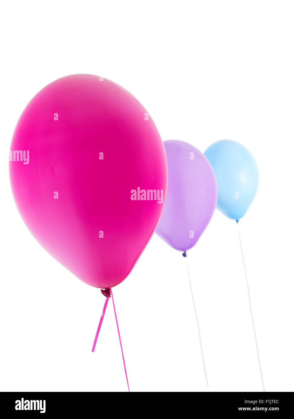 Helium Balloons in a line Stock Photo - Alamy