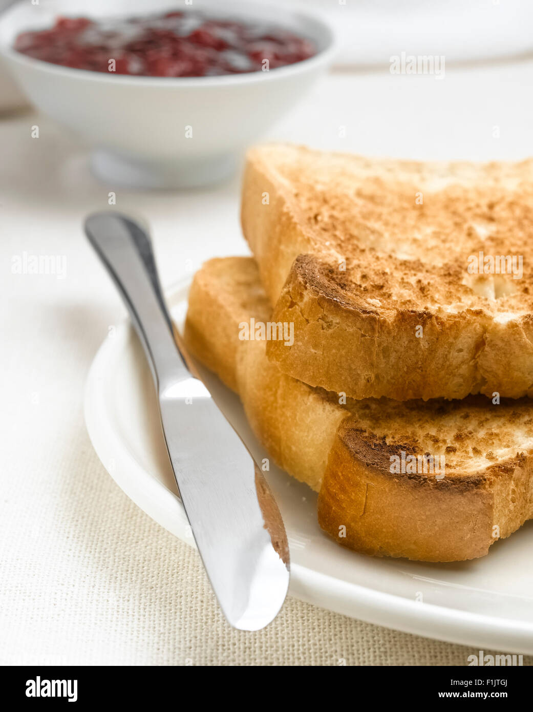 Table with toast and jam Stock Photo - Alamy