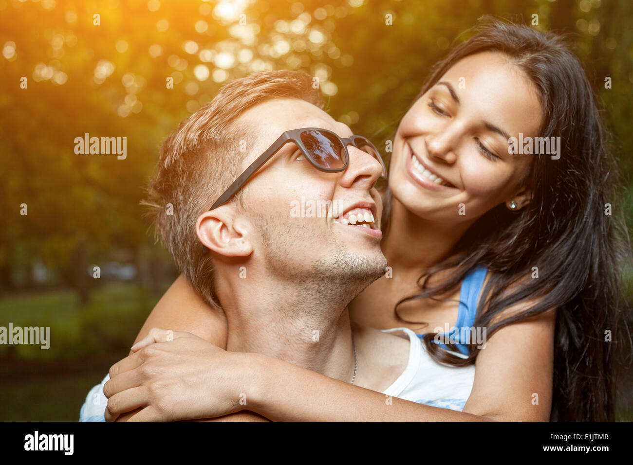 Young happy couple in love having a goot time outdoors Stock Photo - Alamy