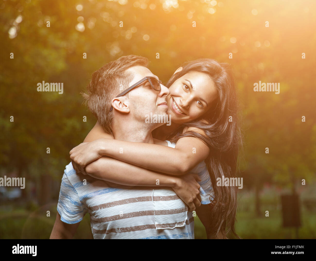 Young happy couple in love having a goot time outdoors Stock Photo - Alamy