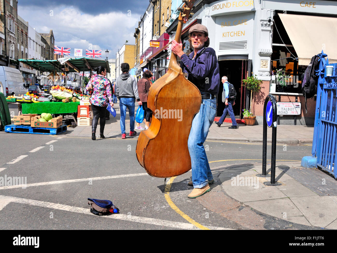 London, England, UK. Portobello Road - busker playing the double bass ...