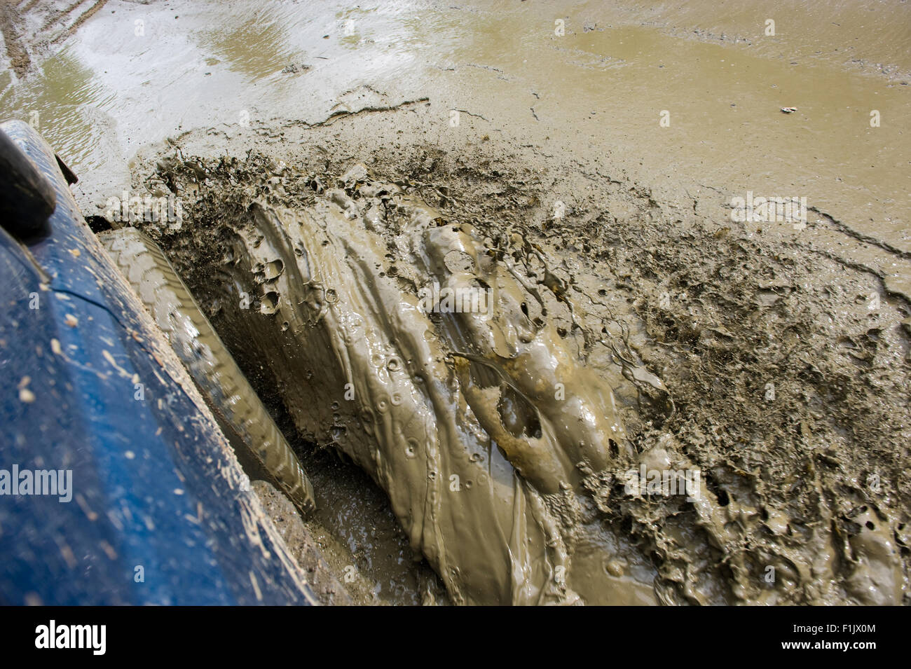 A jeep is driving through a pond of water on a special off the road ...