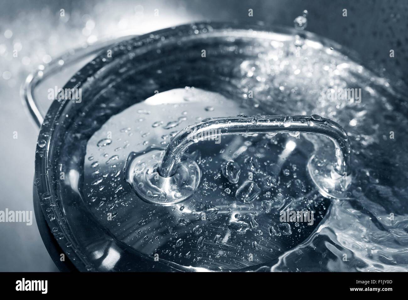 Steel lid from the pan with water drops Stock Photo - Alamy