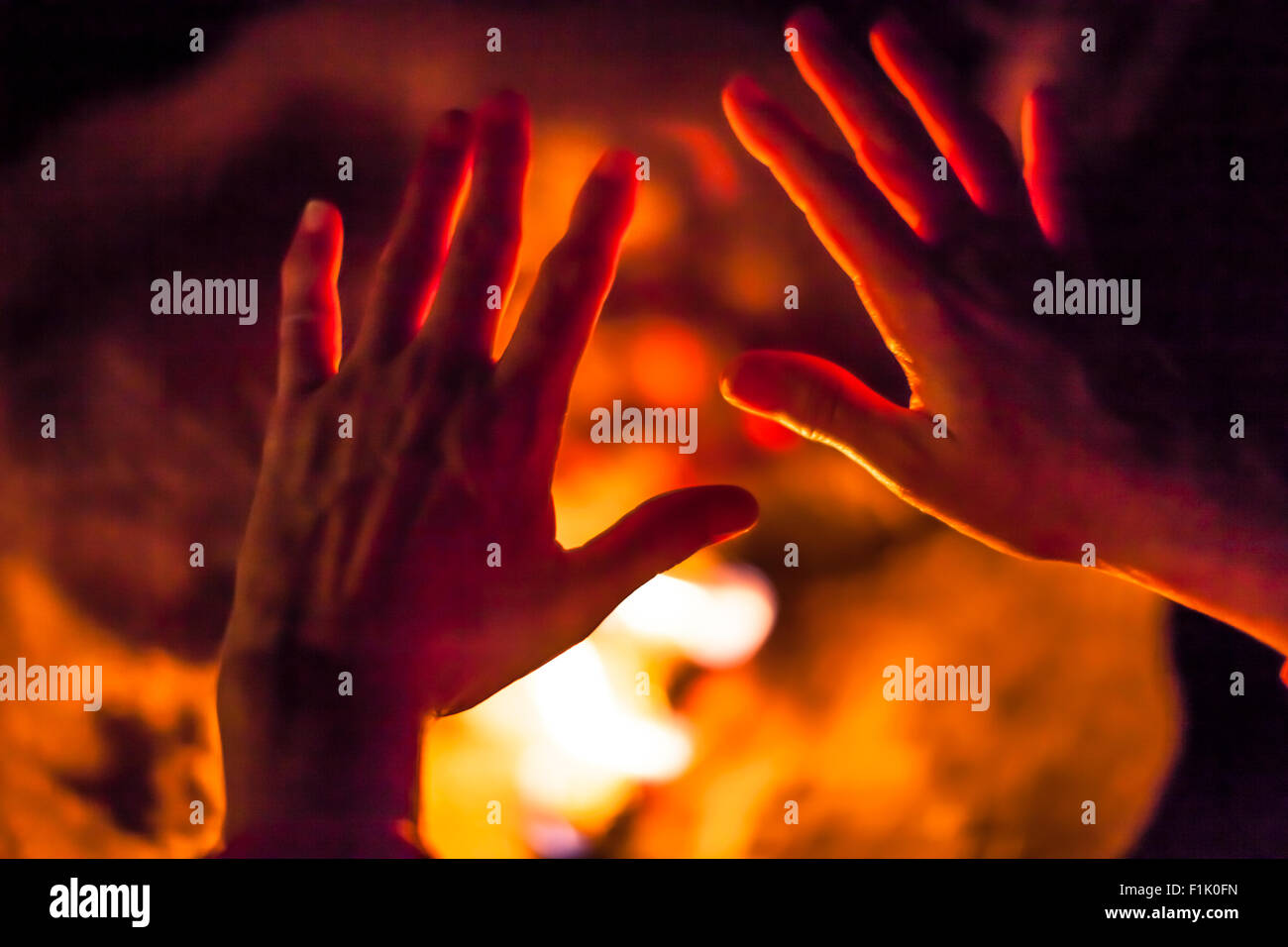 Hands on fire Stock Photo - Alamy
