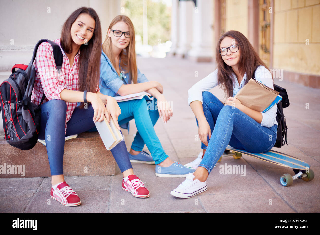 Group of pretty students looking at camera in urban environment Stock ...