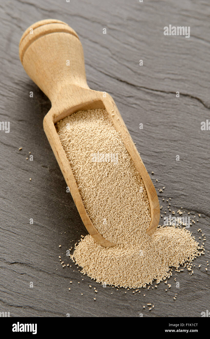 dry yeast and wooden shovel on slate Stock Photo - Alamy
