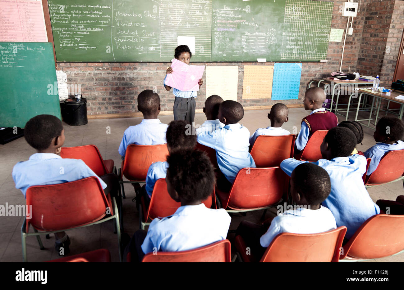 African school pupil presenting to her class Stock Photo - Alamy