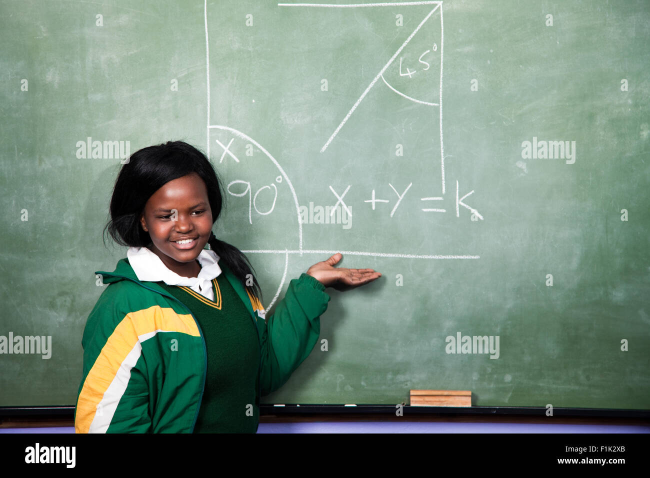 A young girl solving a math sum on a blackboard, Meyerton Primary ...