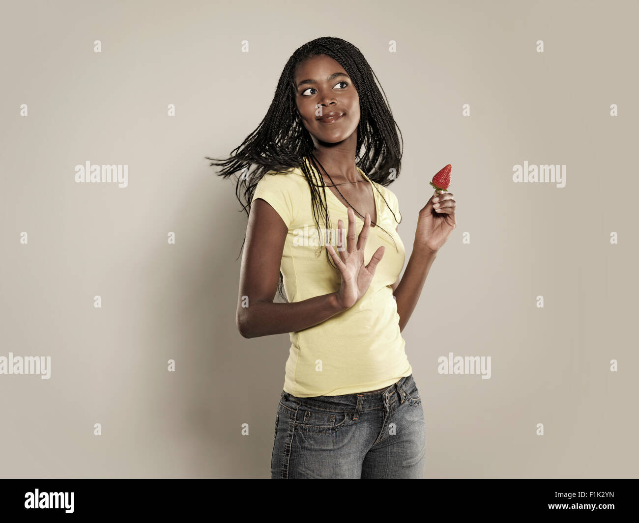 Portrait of Young funky Black woman with fruit Stock Photo - Alamy