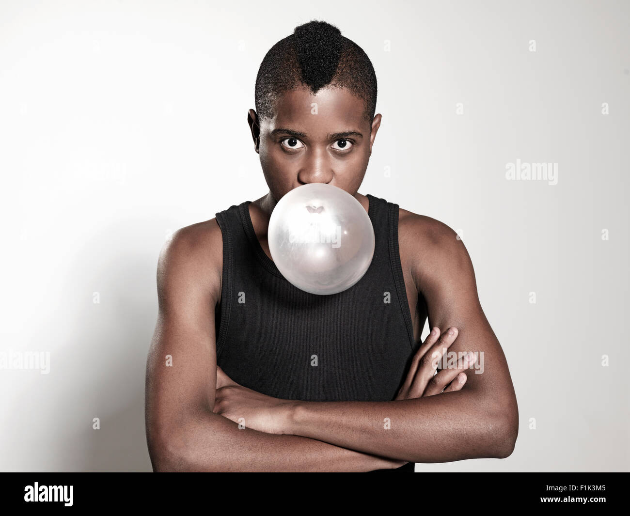 Portrait of funky Young man with chewing gum Stock Photo - Alamy
