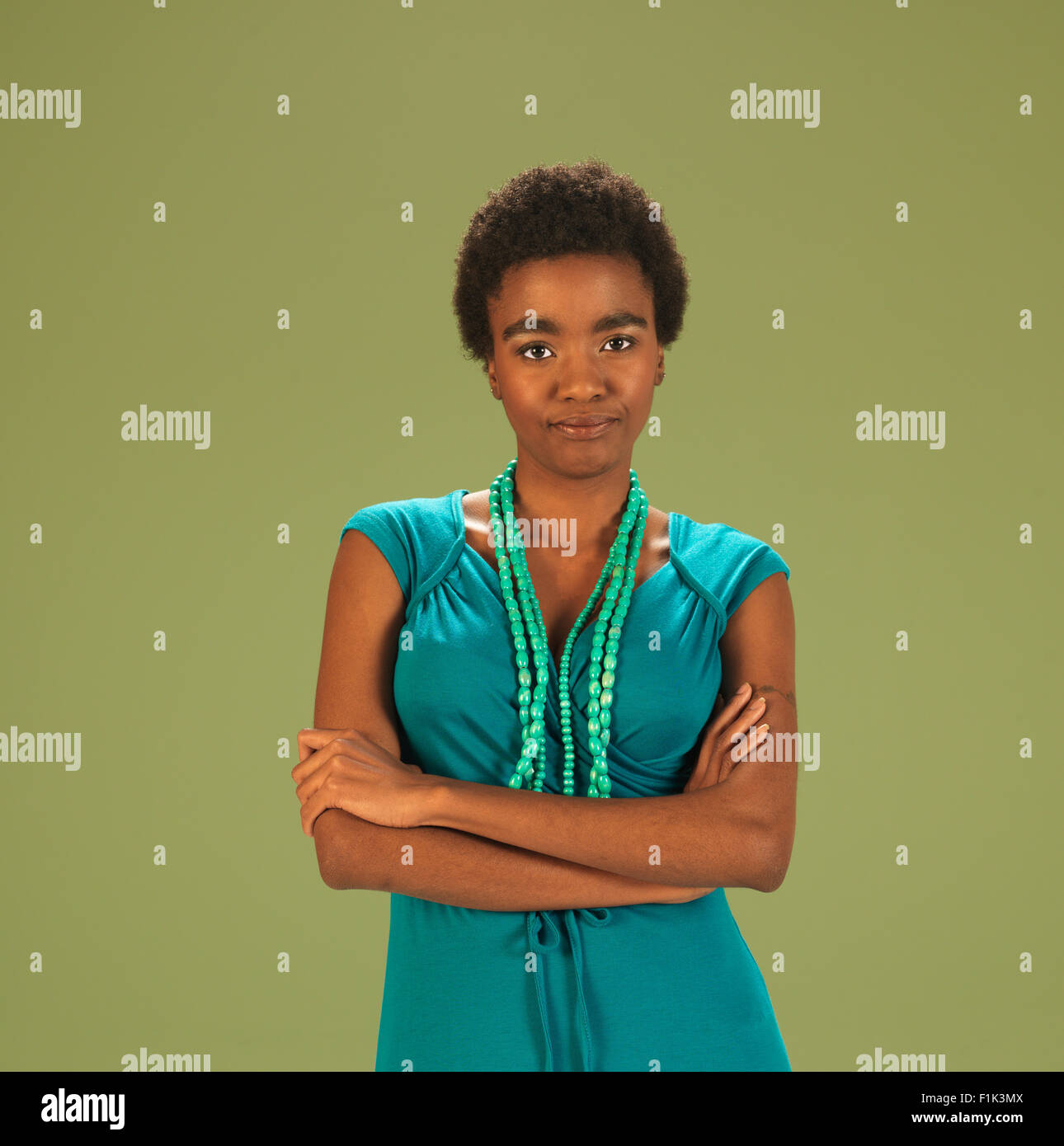 Portrait of a woman with folded arms Stock Photo - Alamy