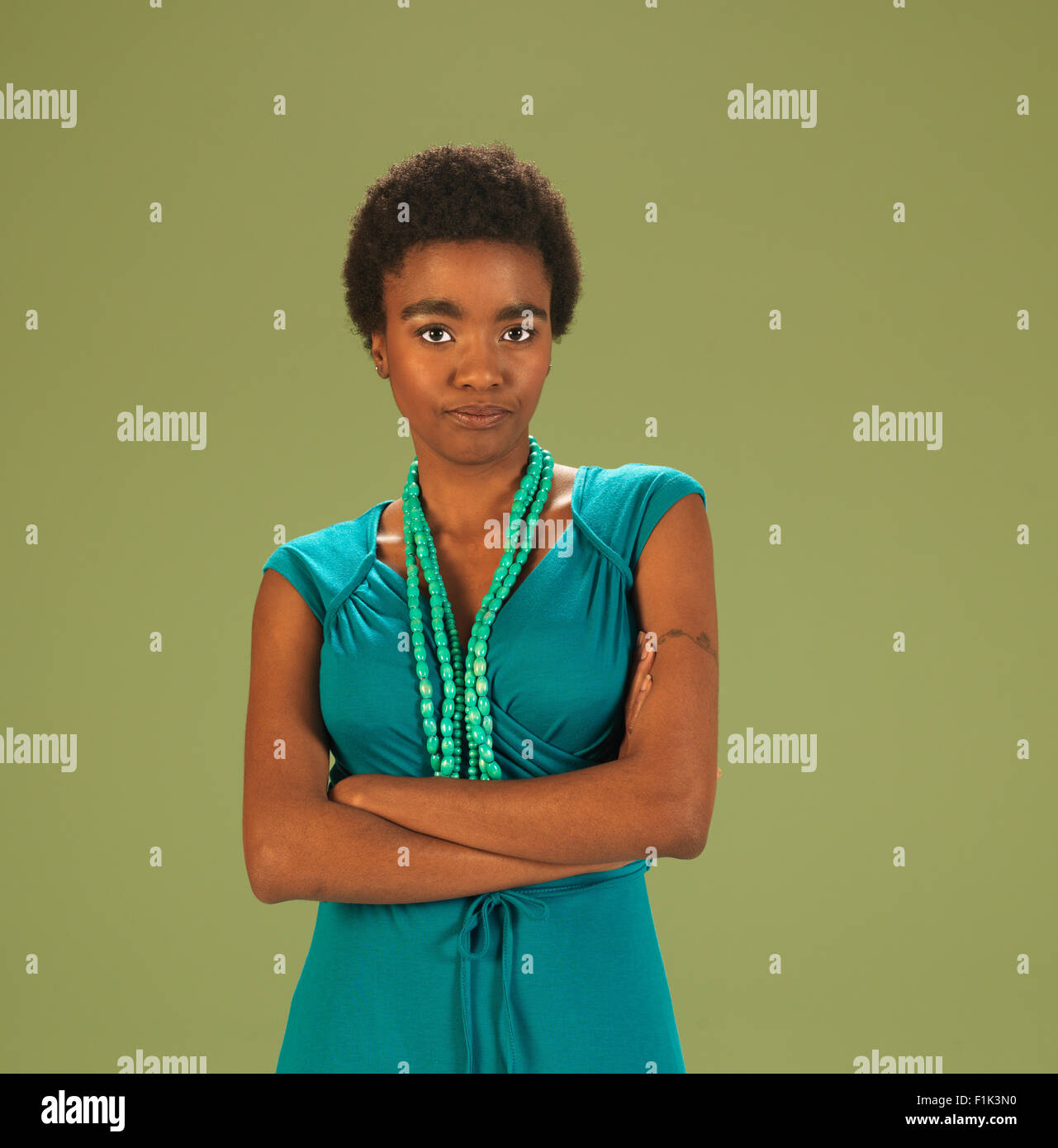 Portrait of a woman with folded arms Stock Photo - Alamy