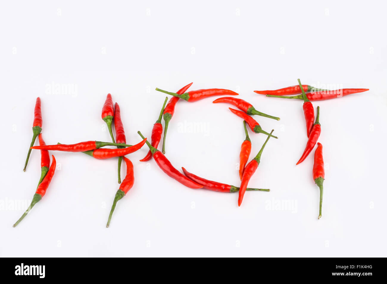 word hot written with chilli in white background Stock Photo - Alamy