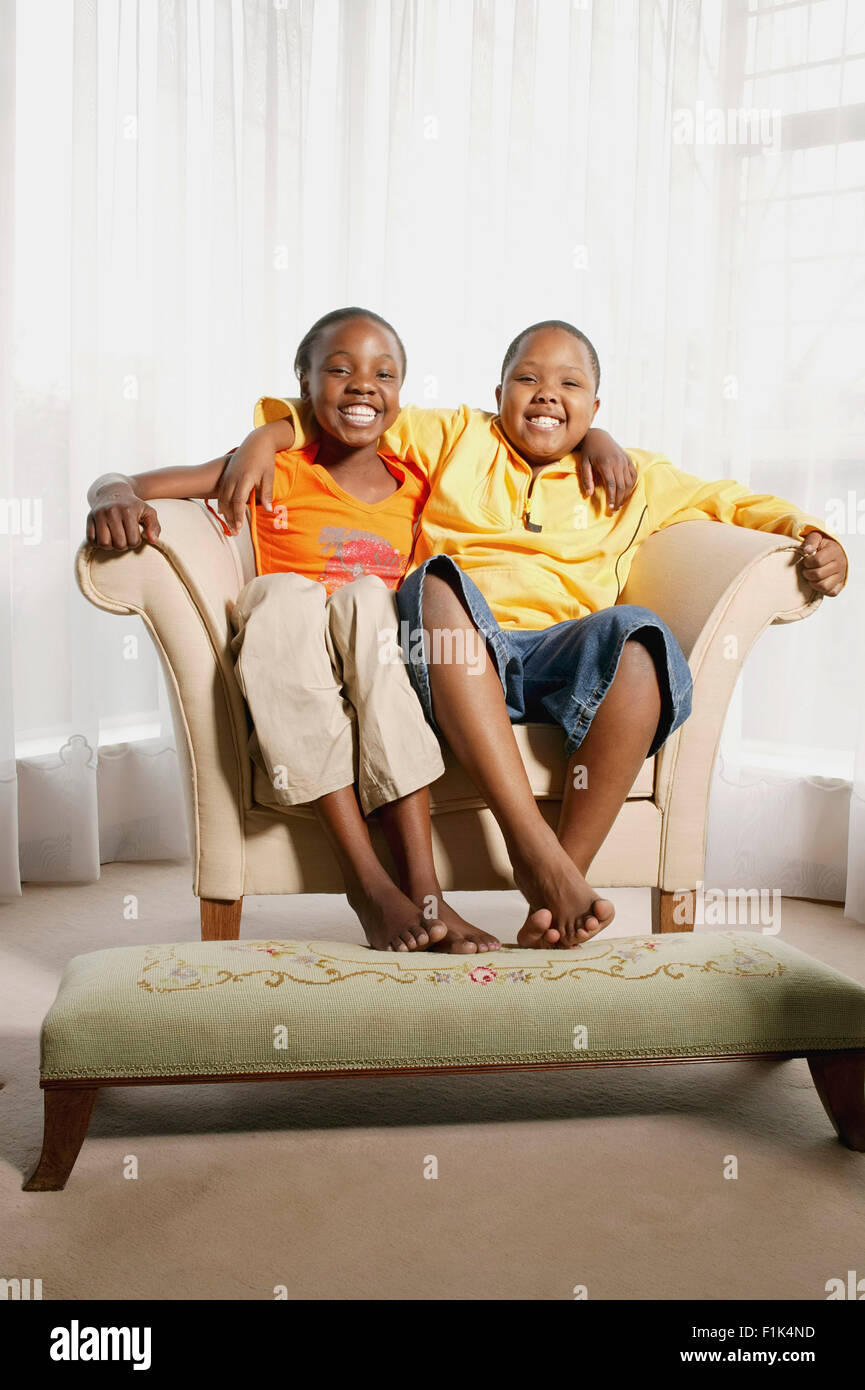Children Sitting in Chair Stock Photo - Alamy