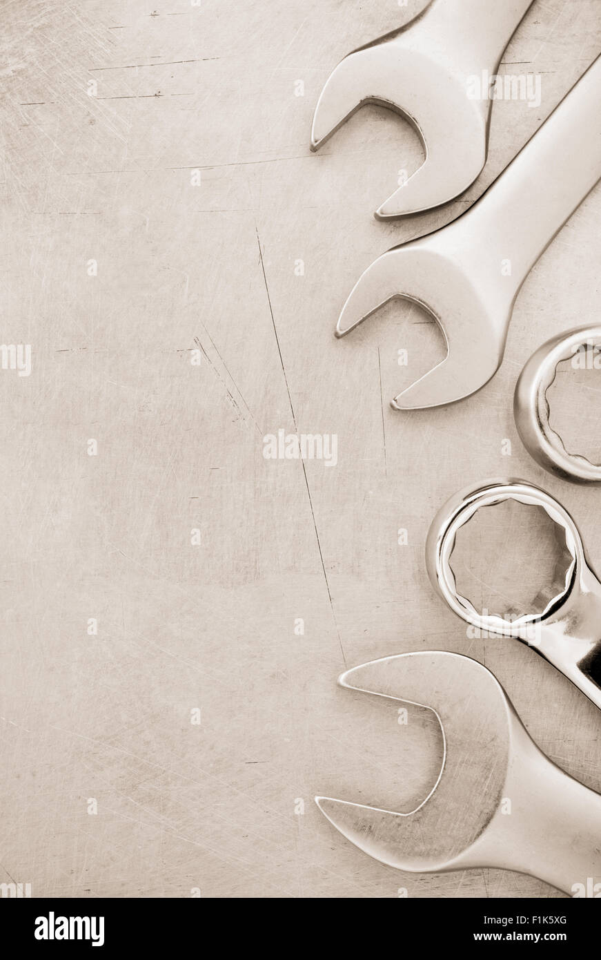 wrench tools at metal background Stock Photo - Alamy