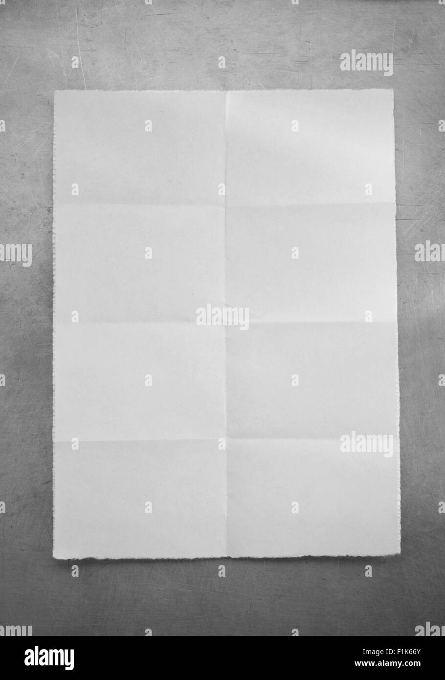 folded note paper at metal background Stock Photo - Alamy