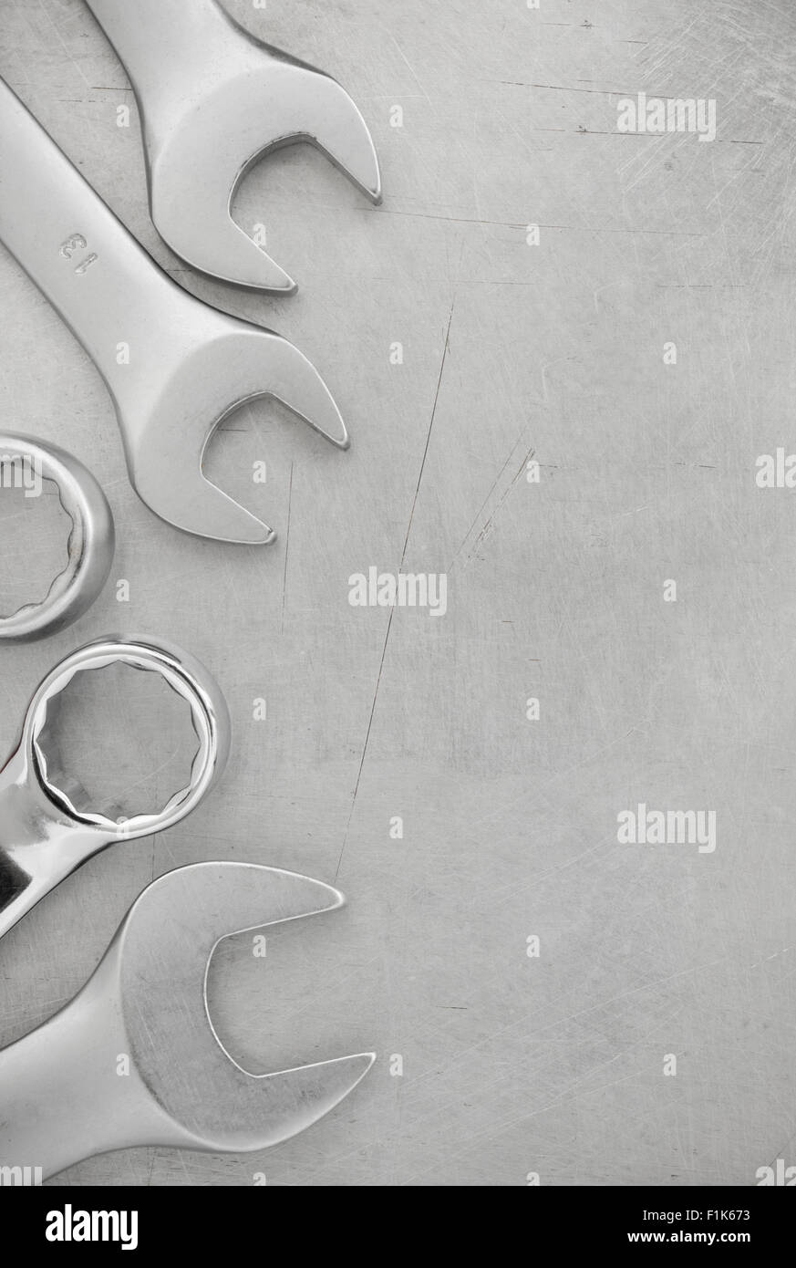 wrench tools at metal background Stock Photo - Alamy