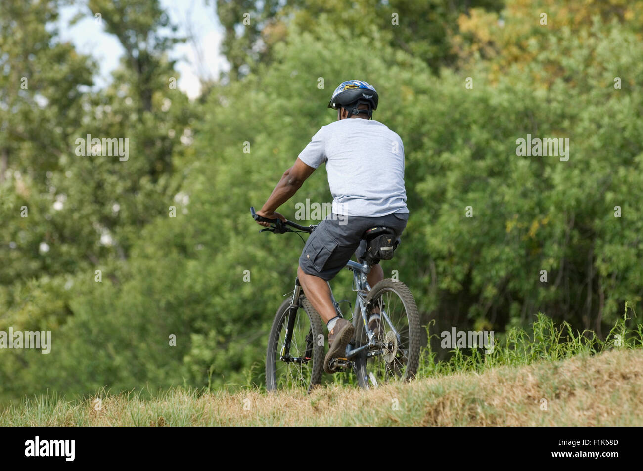 Man riding bicycle Stock Photo - Alamy