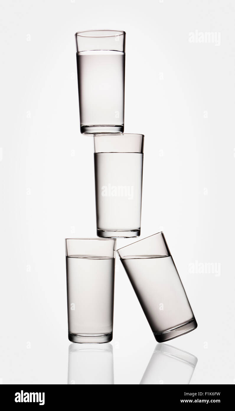 Stacked water glasses balancing Stock Photo - Alamy