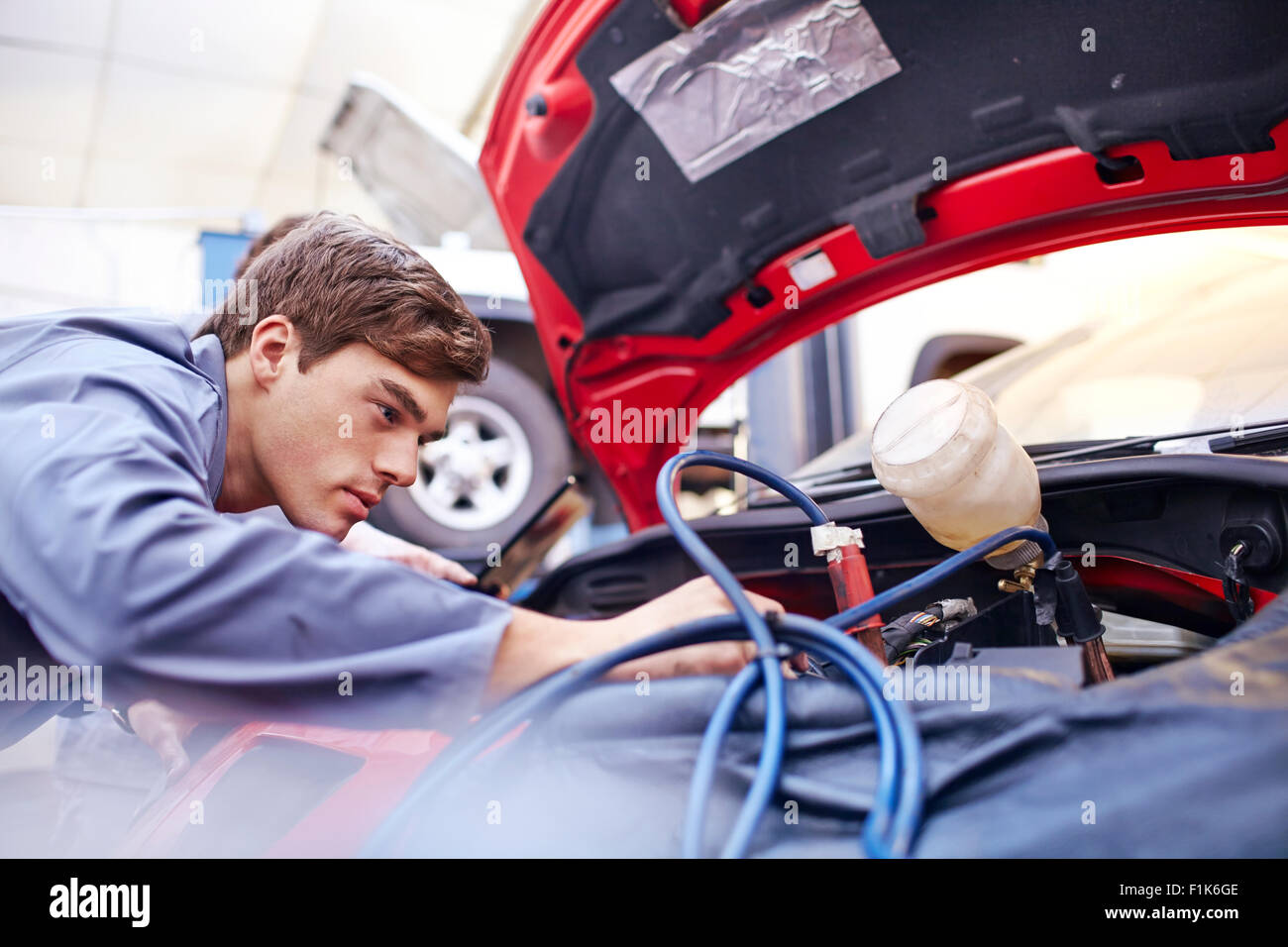 Mechanic working on car hi-res stock photography and images - Alamy