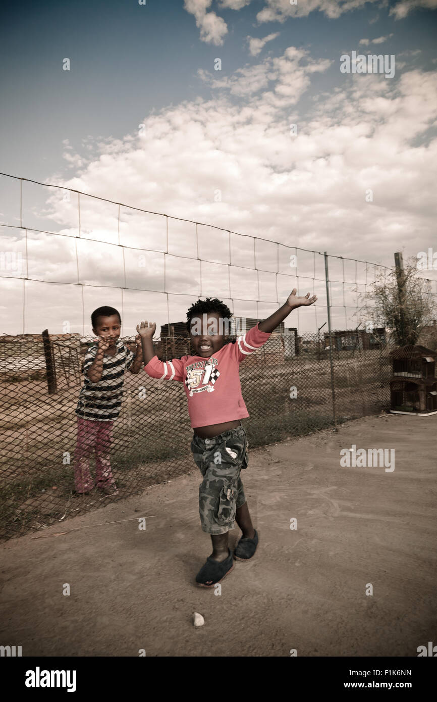 Two African children play together outside Stock Photo - Alamy